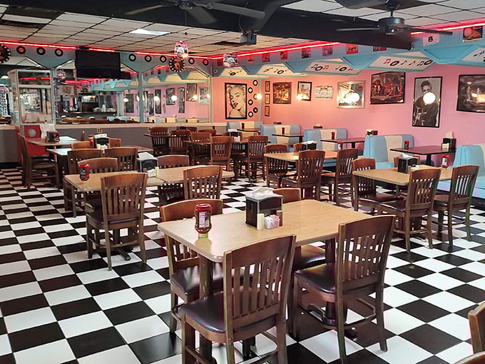 Step inside and the black-and-white checkered floor plays perfect host to turquoise booths and pink walls—a color scheme that somehow makes both nostalgia and hunger intensify simultaneously.