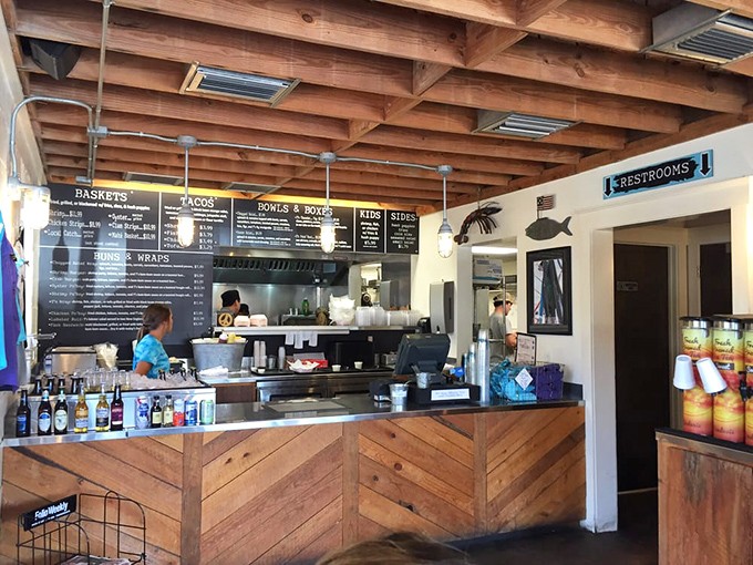 Behind this unassuming wooden counter, seafood magic happens. The exposed beam ceiling and nautical touches say "we're serious about seafood" without shouting it.