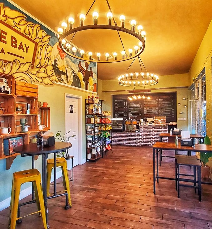 Golden walls and circular chandeliers create the perfect backdrop for sandwich artistry—Edison would approve of both the lighting and lunch options.