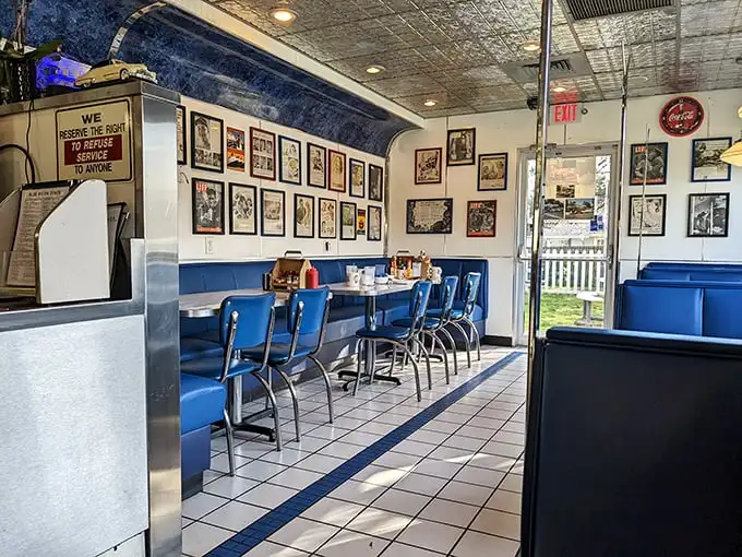Step inside and you're transported to a simpler era – blue vinyl booths, vintage photos, and the promise of comfort food done right.