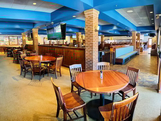 The bright blue ceiling and warm wood tones create that perfect balance of "modern supper club" – comfortable yet contemporary.