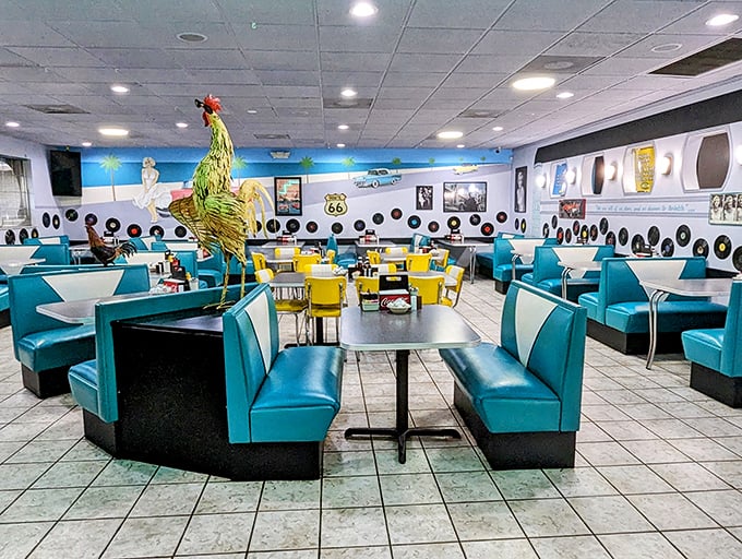 Inside, turquoise vinyl booths and yellow chairs create a retro symphony, while the rooster mascot stands guard over breakfast dreams. Diners' paradise found.