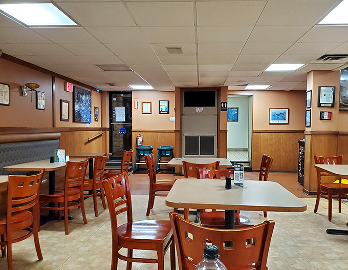 Inside, wood paneling and simple furnishings create the perfect stage for culinary drama. No distractions here—just you and your imminent cheesesteak encounter.