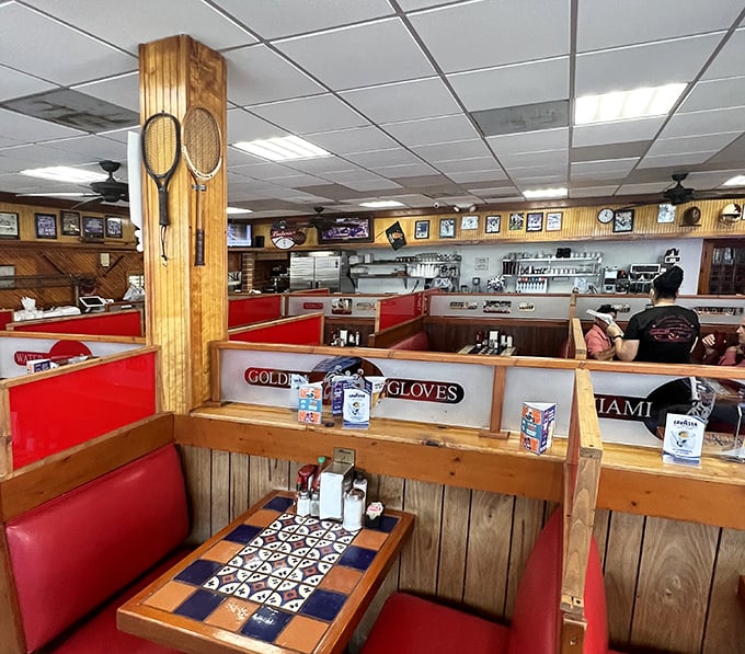 Inside, wooden booths adorned with sports memorabilia create that perfect blend of nostalgia and comfort—like dining in your favorite uncle's trophy room.