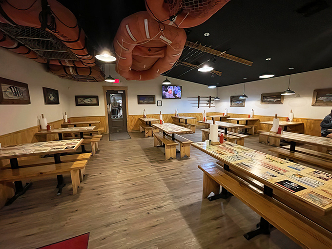 Fishing nets draped from the ceiling aren't just decoration—they're a promise of maritime authenticity. Simple wooden tables invite you to focus on what matters: the food.