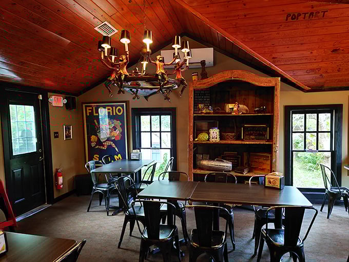 Wooden ceiling beams, quirky décor, and that chandelier—this isn't just a restaurant, it's someone's wonderfully eccentric living room that happens to serve amazing food.