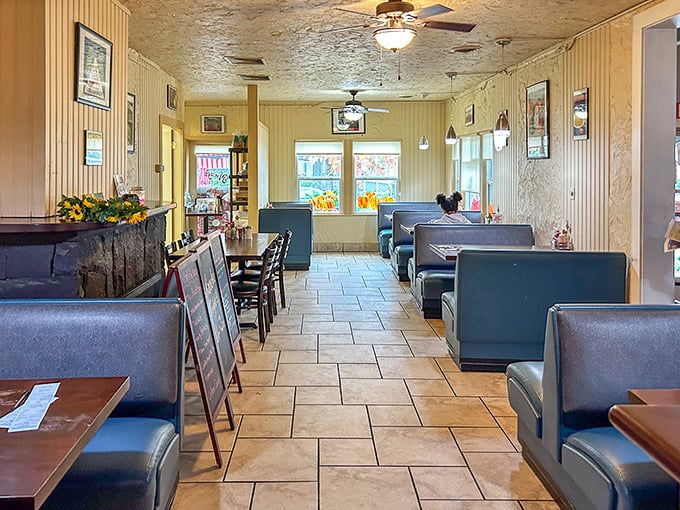 Step inside and time slows down – blue vinyl booths, warm lighting, and that unmistakable diner aroma that instantly triggers childhood memories.