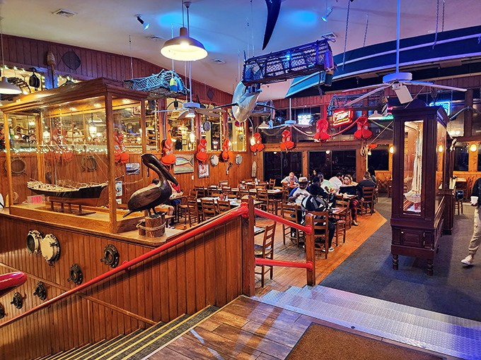 Step inside and you're transported to a maritime wonderland where wooden paneling, nautical artifacts, and the promise of seafood create an irresistible siren song.