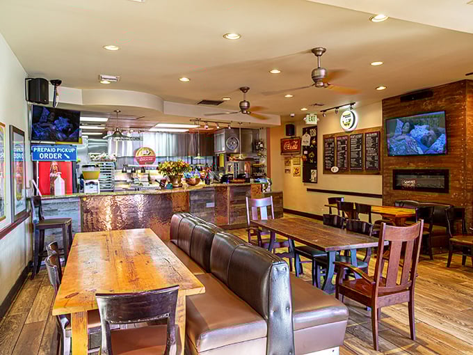 Rustic wooden tables meet copper-topped counters in this cozy haven where comfort food reigns supreme.