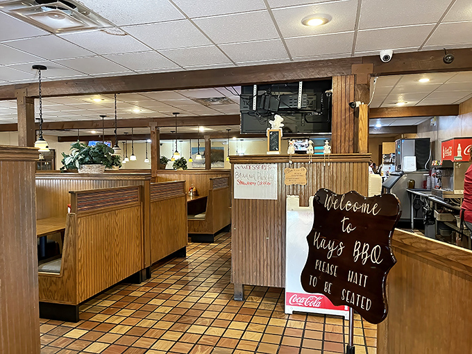 Step inside and you're greeted by that classic "please wait to be seated" sign – the universal symbol that good things come to those who wait.