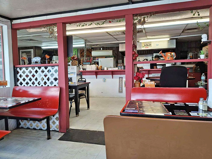 Step inside and you're transported to a simpler time. Red booths, white lattice dividers, and zero pretension—just the promise of honest-to-goodness Florida comfort food. 