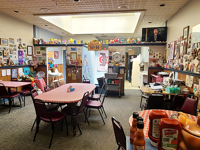 Inside, a museum of memories lines the walls while red-checkered tablecloths promise homestyle comfort. The salt and pepper shaker collection watches over hungry diners.