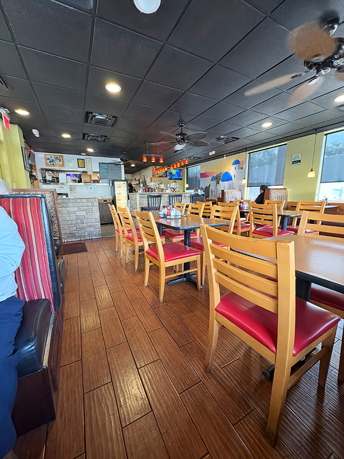 Inside, wooden floors and bright red cushions create that "where everybody knows your name" vibe. No pretension here—just honest comfort and the promise of breakfast bliss.