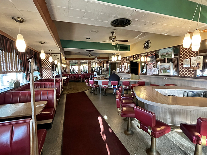 Red vinyl booths and counter stools that have witnessed decades of local gossip. This isn't retro by design—it's authentic by persistence.