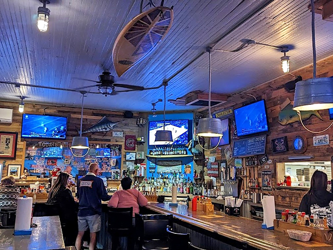 The classic coastal bar vibe hits you immediately – wood paneling, nautical decor, and TVs tuned to the game. It's seafood heaven without pretension.