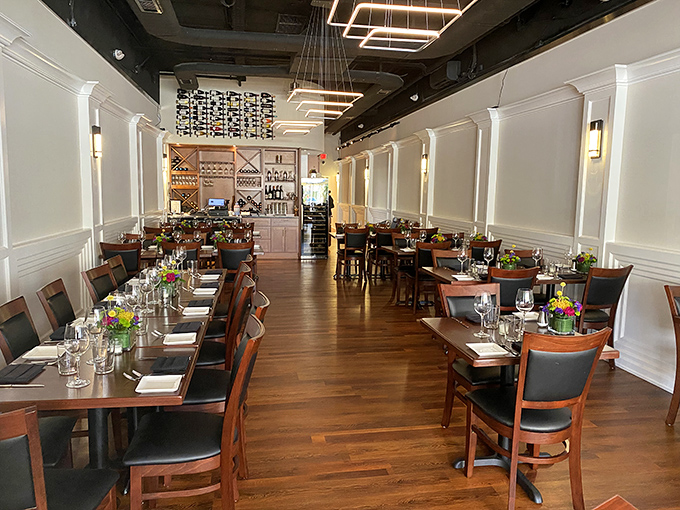 Elegant simplicity defines Guerrera's interior—warm wooden floors, crisp white wainscoting, and modern lighting creating the perfect backdrop for beef-centered bliss.