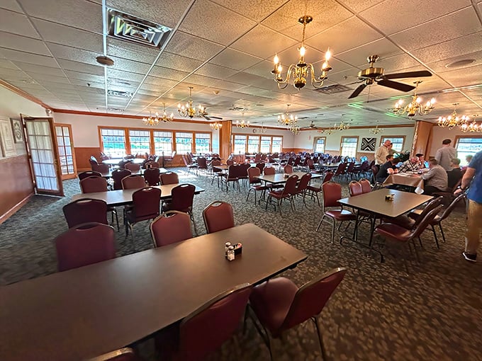 Chandeliers cast a warm glow over simple tables where memories are made one bite at a time. Fancy without the fuss.