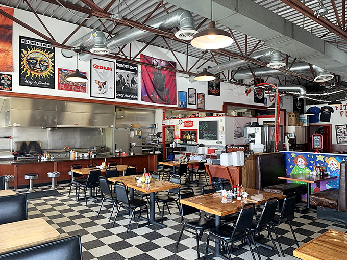 The checkered floor and vintage posters aren't manufactured nostalgia—they're the real deal, like finding your favorite uncle's basement rec room.