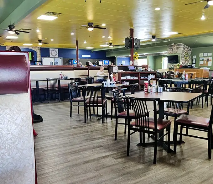 Classic diner ambiance with burgundy booths and wood-look flooring. The ceiling fans lazily circulate the intoxicating aromas of breakfast served all day.