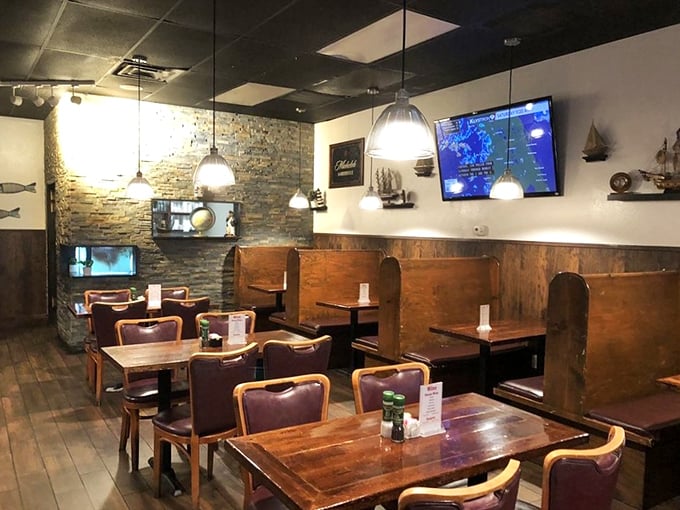 Cozy wooden booths, stone accent walls, and nautical touches create that perfect "I've discovered something special" atmosphere that makes regulars out of first-timers.