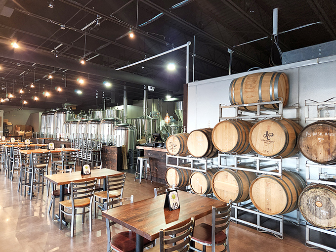 Industrial-chic meets beer barrel elegance. The brewing tanks aren't just for show—they're the beating heart of this flavor laboratory.