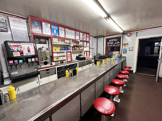 Ten red stools await hungry patrons at this legendary counter, where decades of short-order wisdom transform humble ingredients into breakfast magic.
