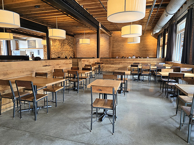 Industrial-chic meets cozy comfort in this thoughtfully designed dining space. Reclaimed wood tables and drum pendant lighting create the perfect backdrop for memorable meals.
