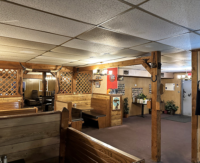Wooden booths and lattice dividers create the perfect balance of privacy and ambiance—like your favorite uncle's basement, if your uncle were a steak wizard.
