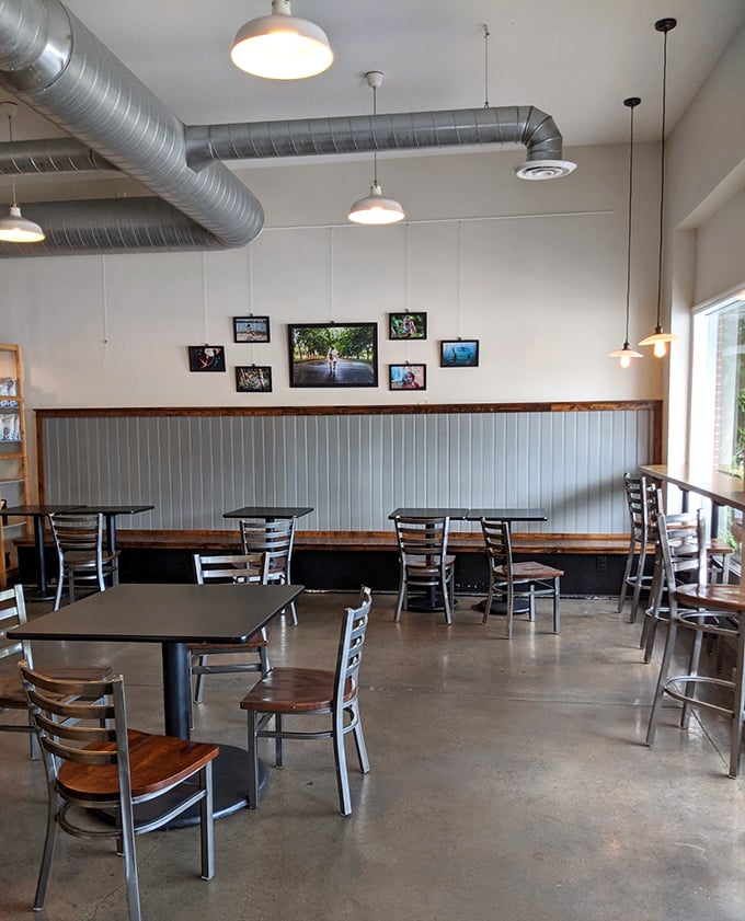 Industrial meets cozy in this thoughtfully designed space. The exposed ductwork and pendant lighting create an atmosphere that says "we're serious about food, but not too serious about ourselves."