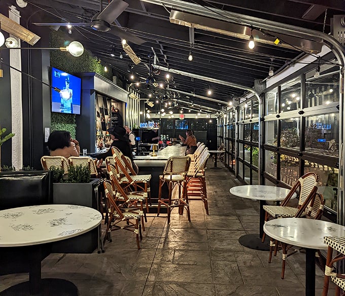 Step inside and time slows down – the bar area's warm lighting and bistro chairs invite you to linger over cocktails before the main event.