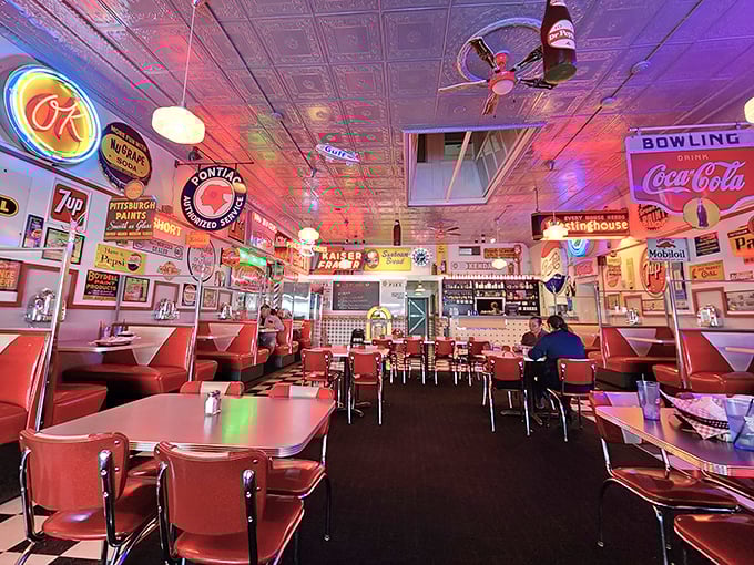 Step inside and the neon glow bathes everything in that perfect nostalgic light, where vintage signs aren't decorations but witnesses to decades of memorable meals.