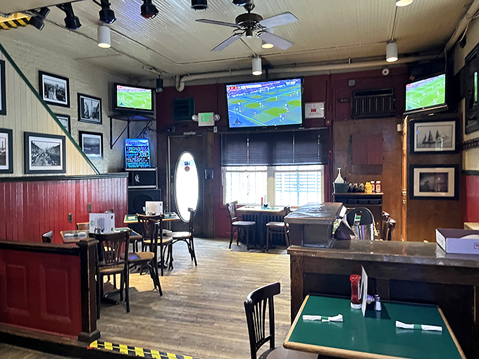 Inside, wooden floors and red wainscoting create that perfect neighborhood pub atmosphere where sports fans gather and crab cake dreams come true.