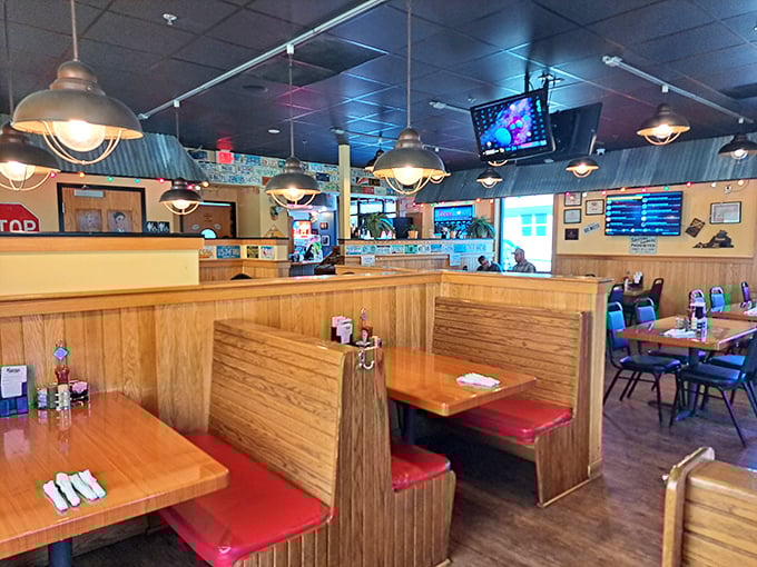 Classic wooden booths with cherry-red seats create that perfect "focus-on-the-food" atmosphere. No distractions from the barbecue mission at hand.