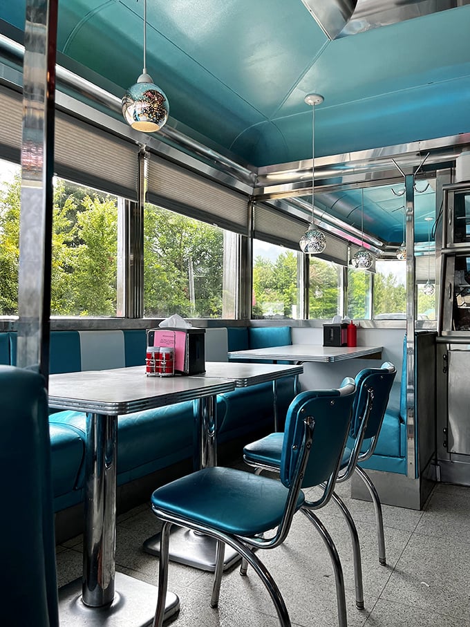Sliding into these turquoise vinyl booths feels like stepping into a Buddy Holly song. The chrome accents aren't retro—they're authentically vintage.