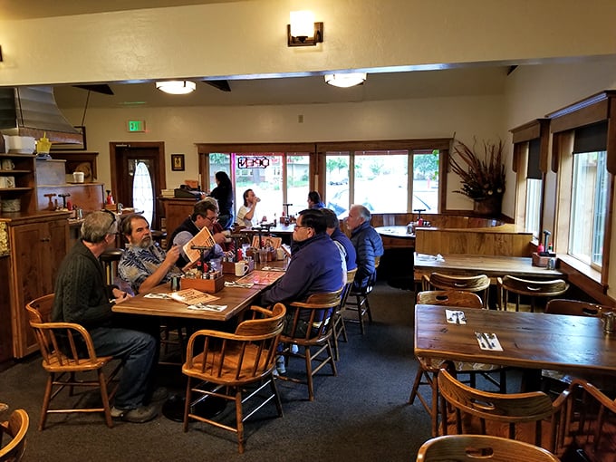 Inside, wooden chairs and warm lighting create that perfect "everybody knows your name" vibe. This isn't Instagram-designed decor; this is authentic breakfast bliss.