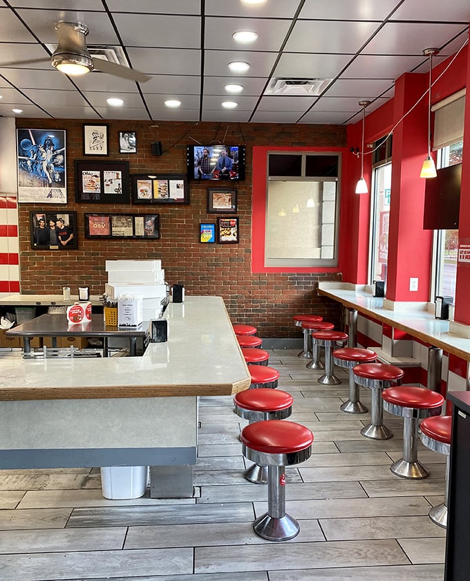 Red vinyl stools and brick walls create the perfect no-frills atmosphere where donuts and conversation flow with equal abundance.