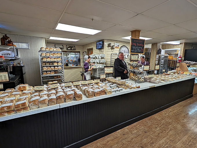 Bread heaven exists, and it's behind this counter. Loaves stacked with military precision, each promising a taste of Pennsylvania Dutch perfection.