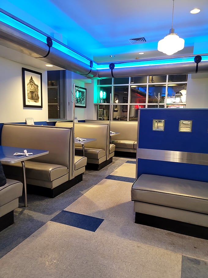 Classic diner booths bathed in cool blue light create the perfect backdrop for both first dates and family reunions. Nostalgia never tasted so good.