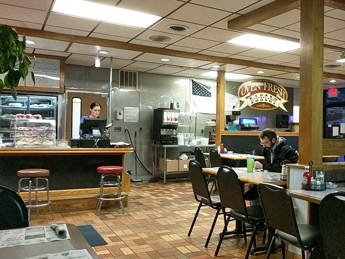 Classic diner ambiance that whispers, "Sit a spell." Wood paneling and counter seating—where strangers become friends over coffee refills.