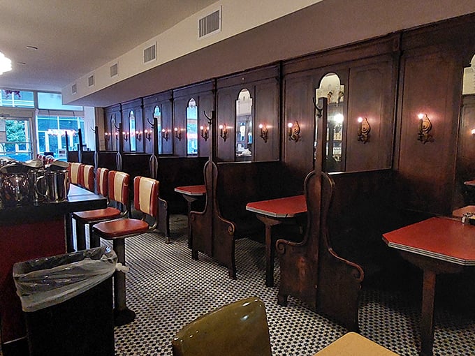 Dark wood paneling, vintage sconces, and those iconic high-backed booths—stepping into Mecca feels like time travel with the promise of excellent coffee. 