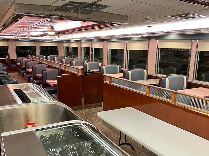 The quintessential diner interior—blue vinyl booths and polished counters waiting for conversations, coffee refills, and comfort food revelations.