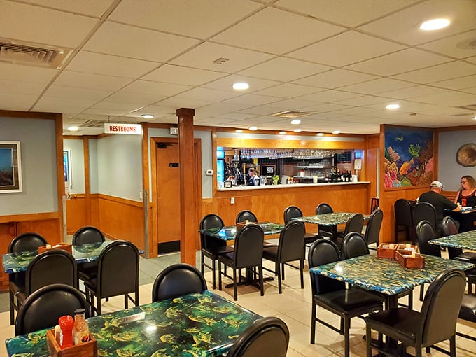 The dining room's underwater-themed tables aren't just decorative—they're setting the stage for the ocean-to-plate experience that keeps locals coming back for decades.