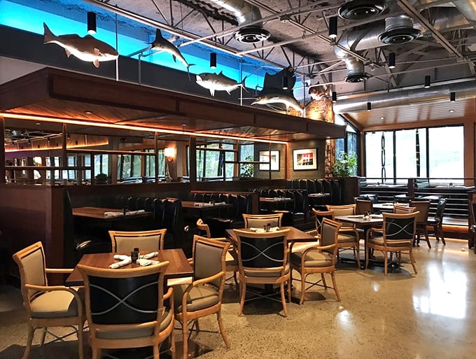 Suspended sharks keep watch over diners below, creating an underwater ambiance that says, "Yes, we're serious about seafood" without being pretentious about it.