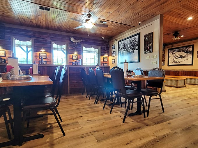 Warm wooden paneling and historic photographs create the perfect backdrop for serious eating. This isn't trendy minimalism—it's timeless comfort.