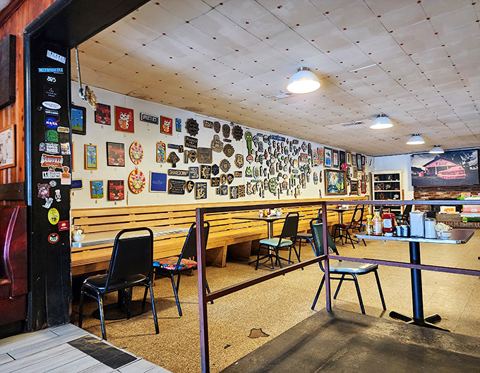 Wall-to-wall memories and memorabilia create the perfect backdrop for comfort food conversations. This isn't decoration—it's a community scrapbook.