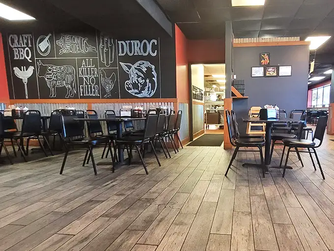 Industrial chic meets meat-lover's paradise. The chalkboard wall's pig illustrations aren't just decoration—they're a preview of coming attractions.