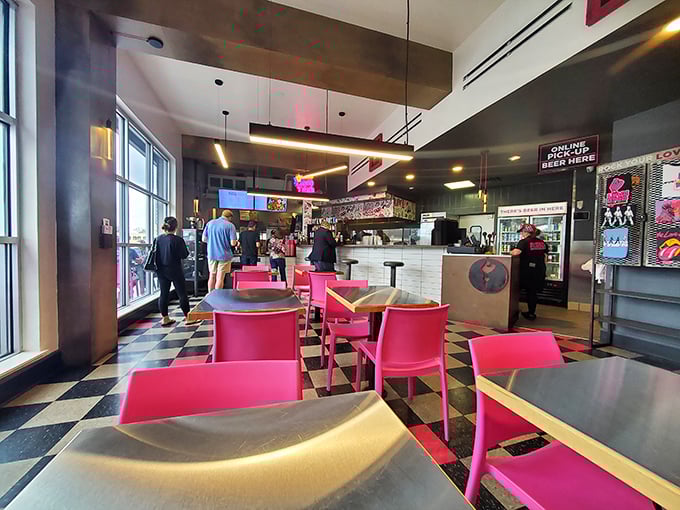 Step inside and the retro-meets-rock-and-roll vibe hits you immediately. Those pink chairs aren't just furniture—they're a promise of something bold to come.