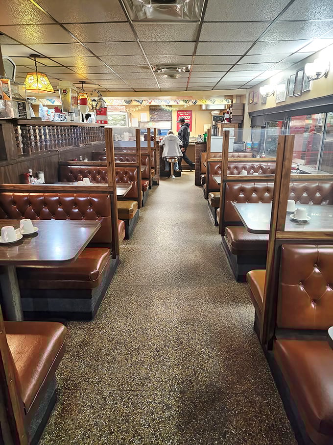 Classic diner perfection awaits inside with those tufted brown vinyl booths – the kind that have cradled generations of pancake enthusiasts in their comfortable embrace.