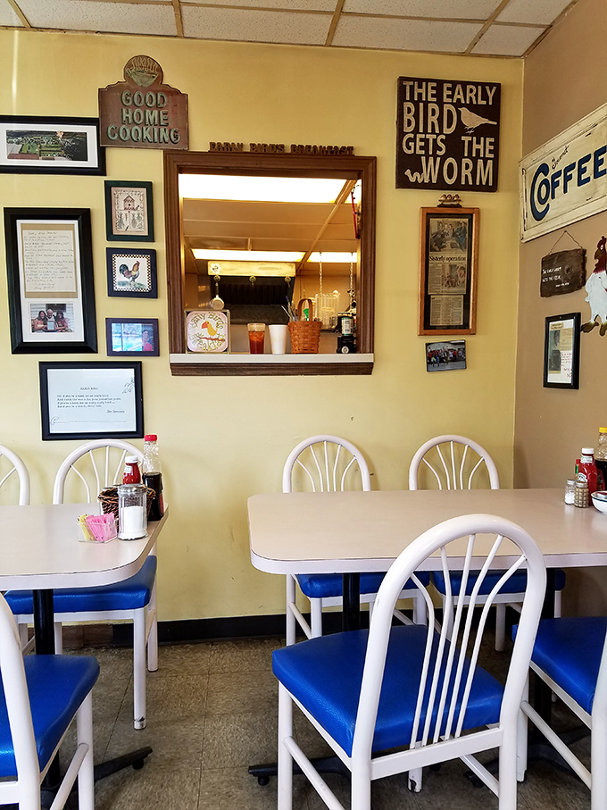 Blue chairs and homespun wisdom on the walls—this isn't interior design, it's breakfast philosophy in its purest form. 
