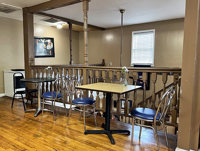 Simple wooden railings and no-nonsense seating tell you everything you need to know: this place prioritizes what's on your plate, not what's on the walls.